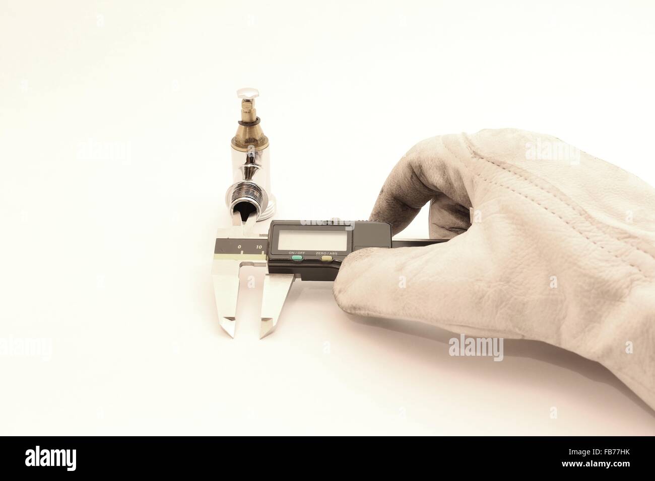 Measuring tools for machining process faucet Stock Photo - Alamy