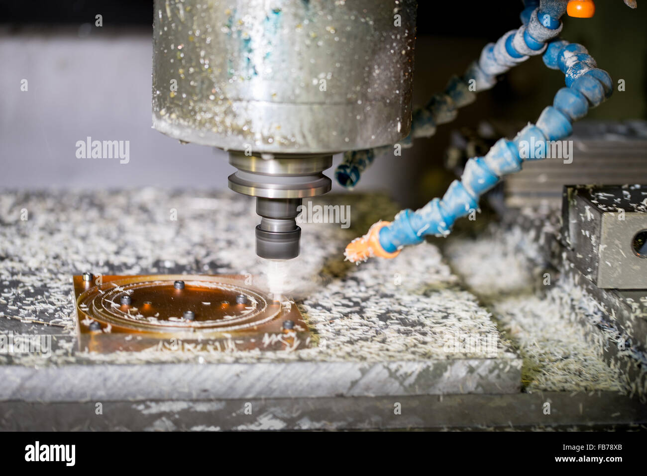 CNC drilling machine in a modern plant making plastic detail Stock ...