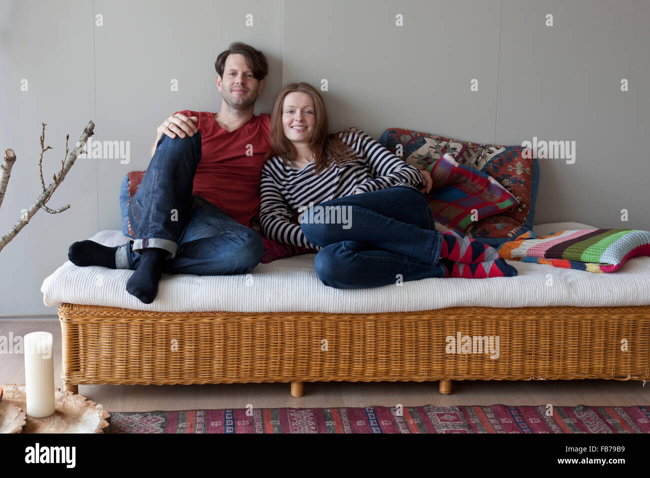 Couple lying on sofa, portrait Stock Photo - Alamy