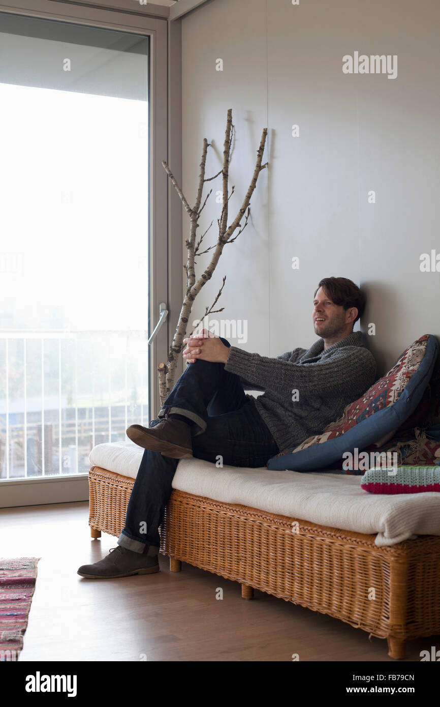 Relaxing man on sofa hi-res stock photography and images - Alamy