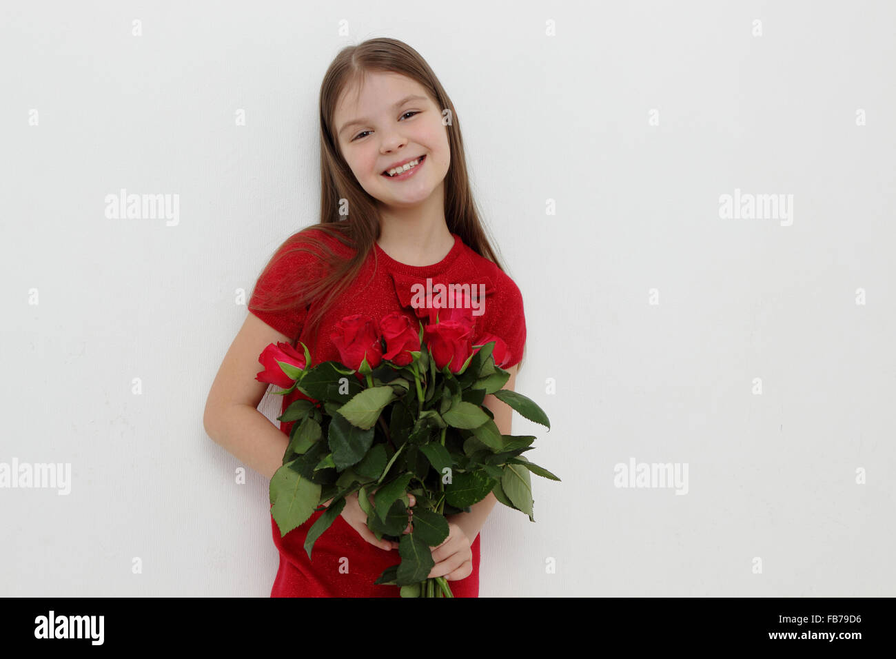 Little girl and red rose Stock Photo - Alamy