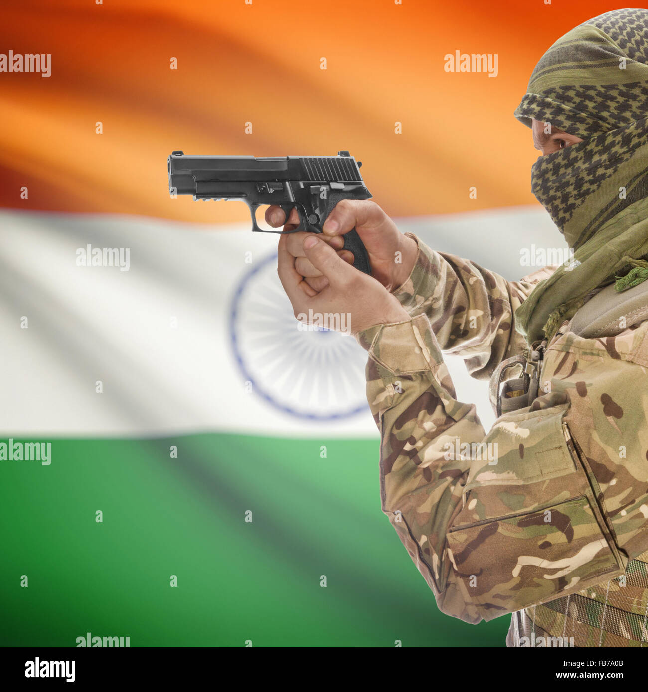Man with gun in hand and national flag on background series - India ...