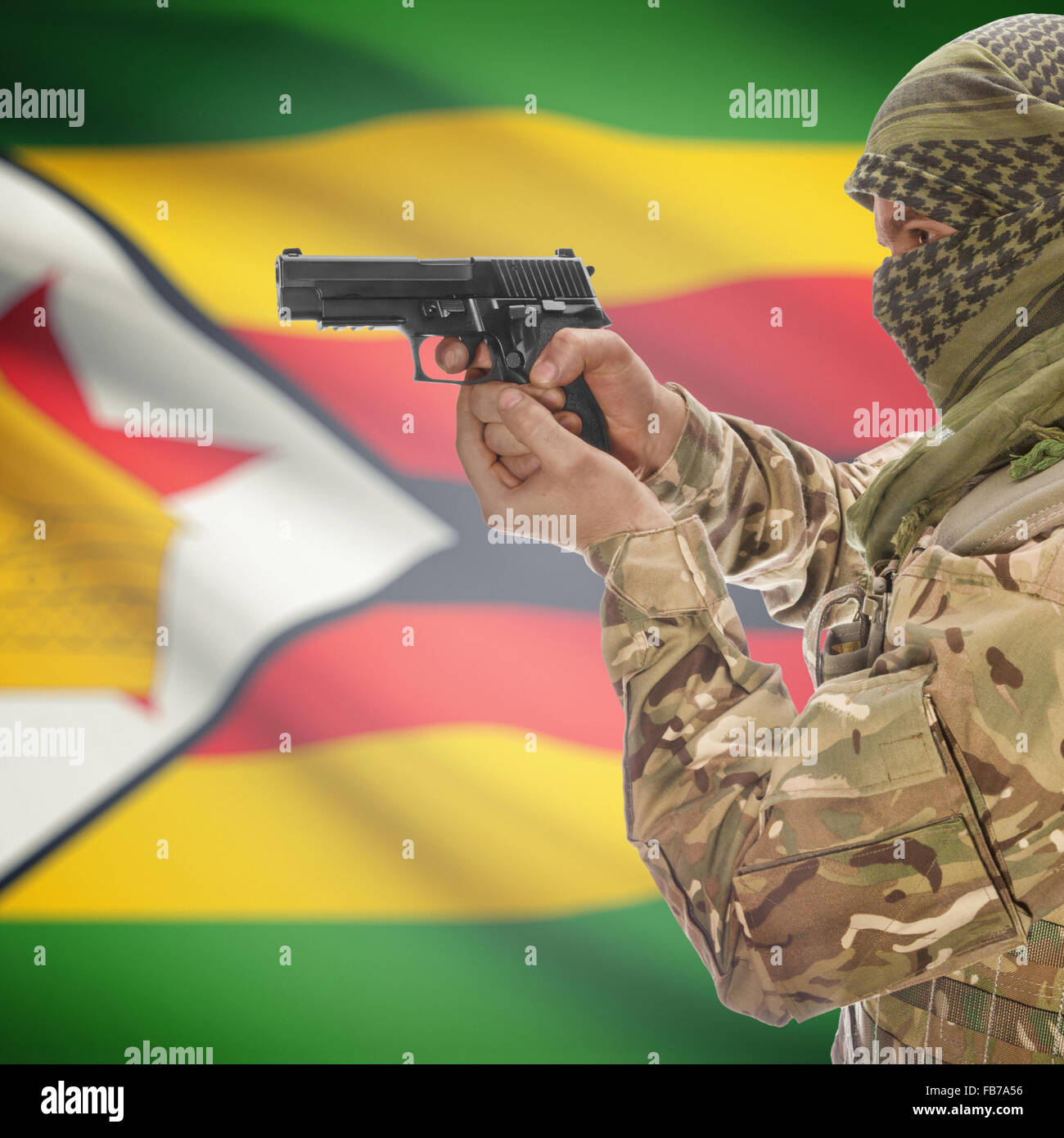 Man with gun in hand and national flag on background series - Zimbabwe ...
