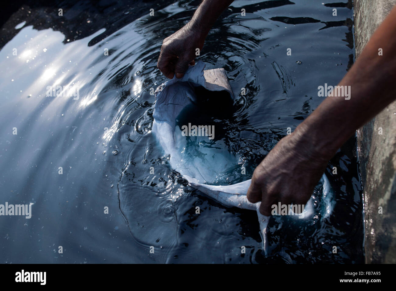 Dhaka, Bangladesh. 11th January, 2016. A worker washing leather using ...