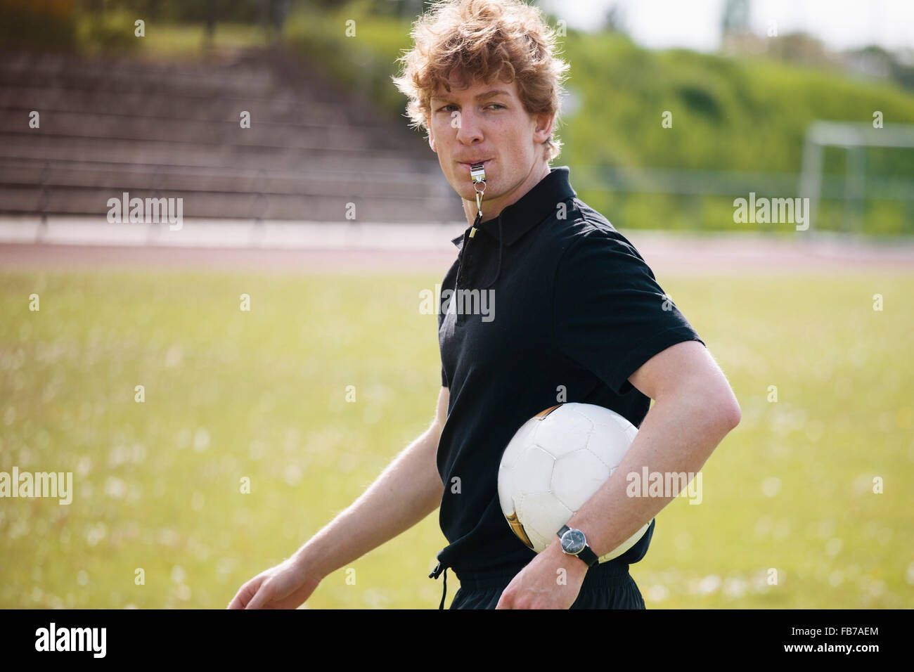 Soccer referee blowing whistle hi-res stock photography and images - Alamy