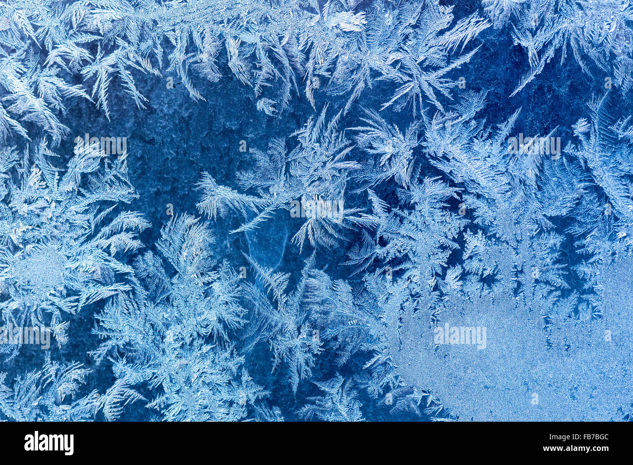 Frosty winter pattern at a window glass Stock Photo - Alamy