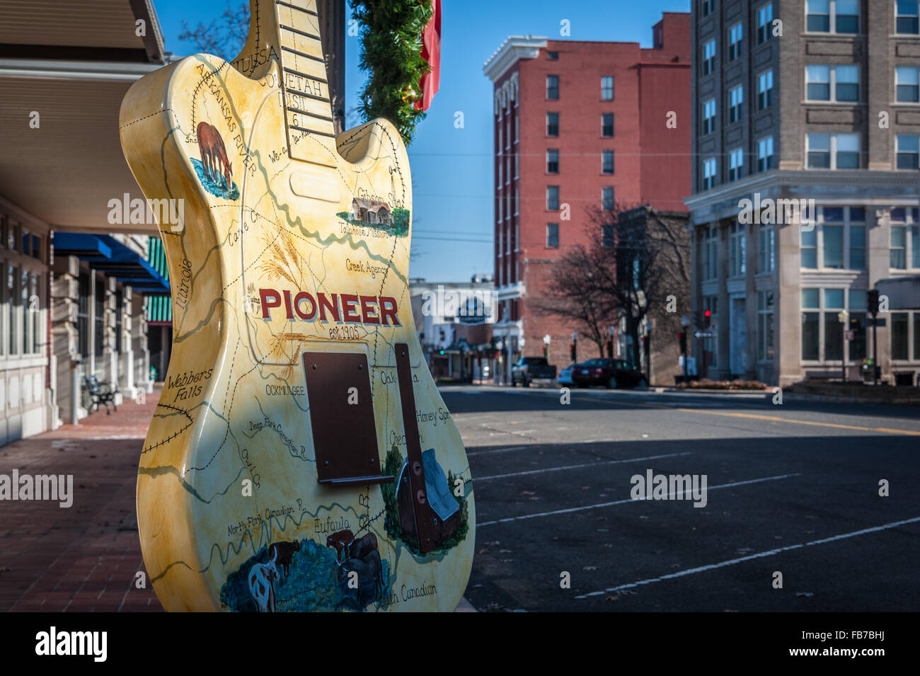Downtown scene with painted guitar markers in Muskogee, Oklahoma, home ...
