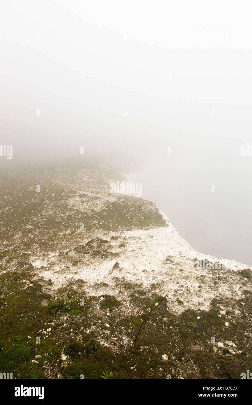 Scenic view of snow covered cliff in foggy weather Stock Photo - Alamy