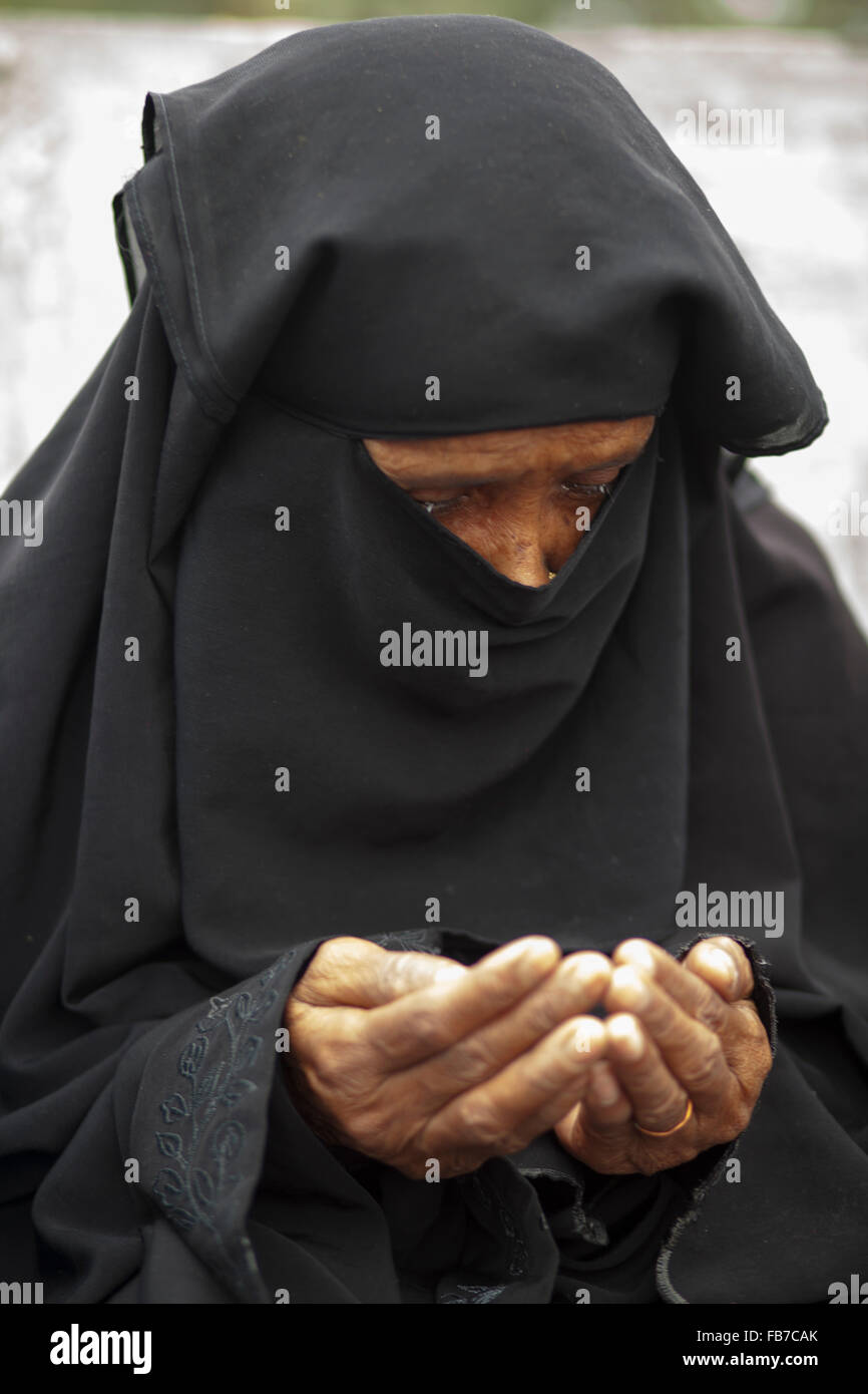 DHAKA, BANGLADESH 10th January 2016: A Bangladeshi Muslim devotee ...