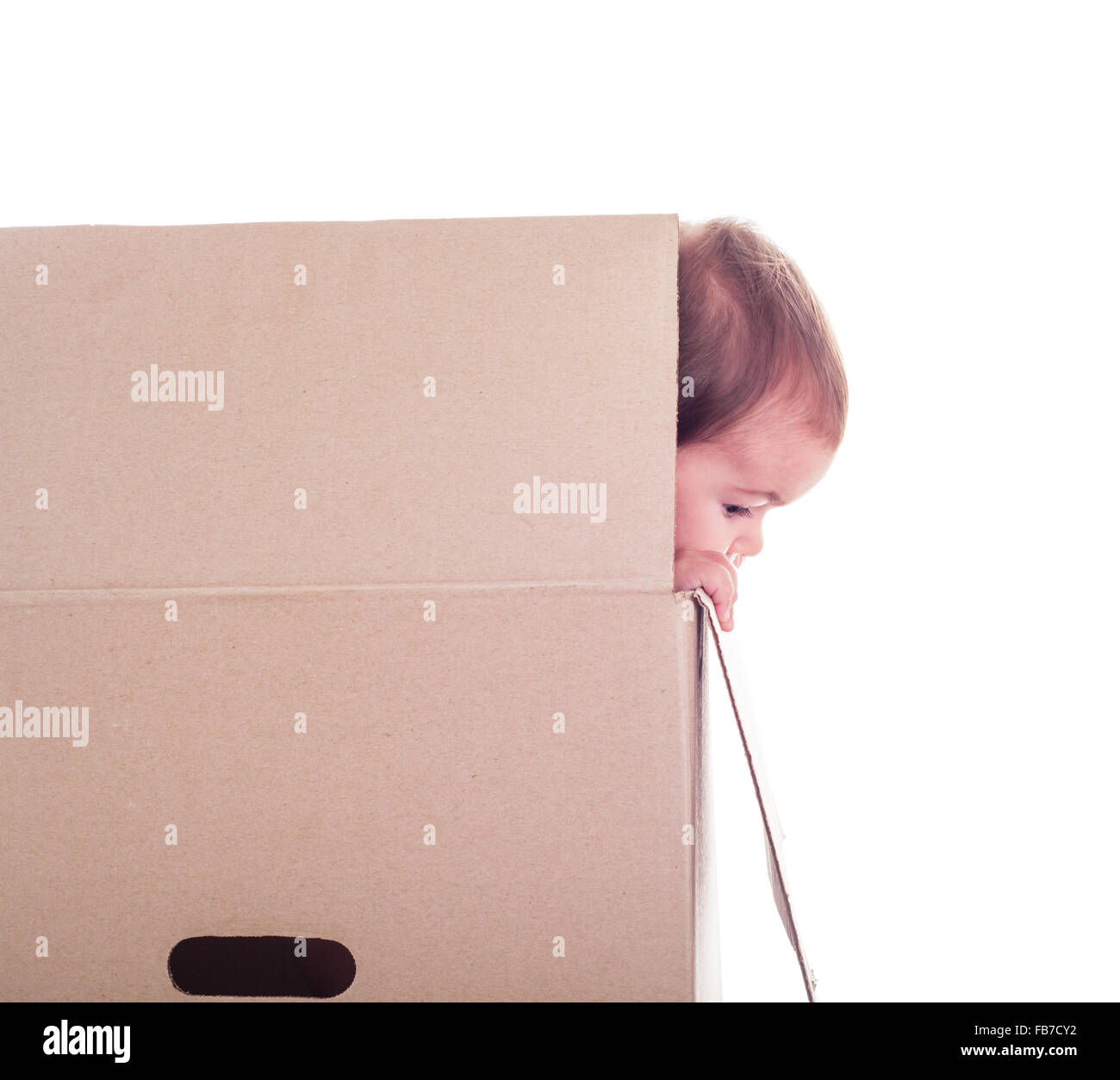 Baby and the box Stock Photo - Alamy