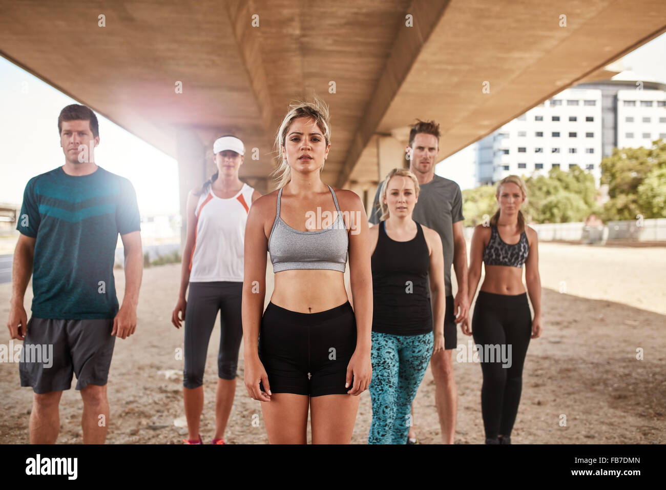 Portrait of running club group standing and looking at camera. Fit ...