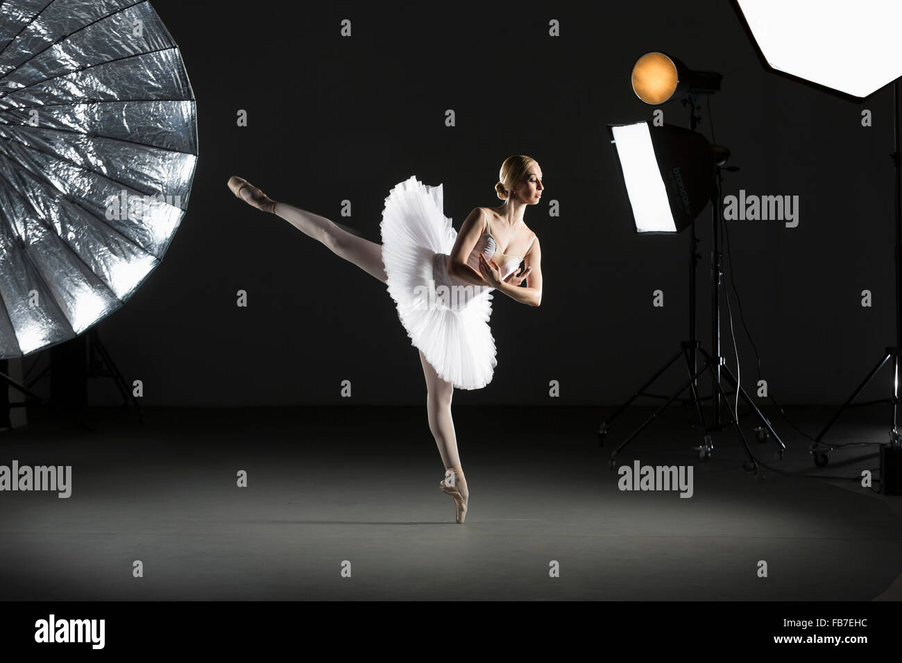 Full length of female ballet dancer performing at studio Stock Photo ...