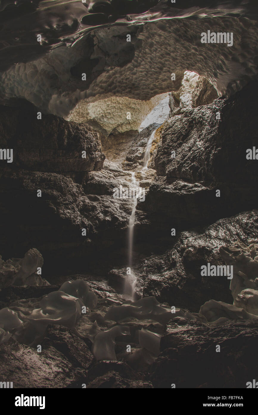 Water flowing through rock Stock Photo - Alamy