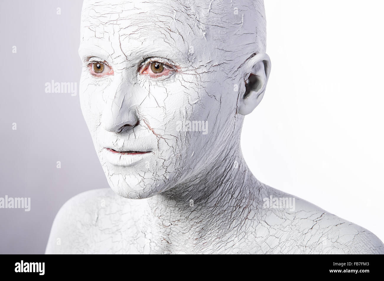 Women face in mud. Scary woman in mud. Spa treatment Stock Photo - Alamy