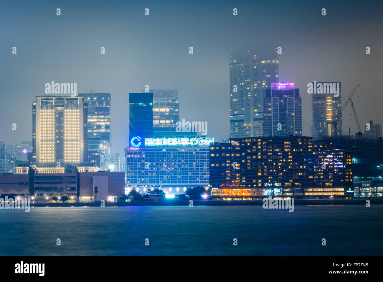 View of the skyline of Tsim Sha Tsui at night, seen from the Expo Promenade in Hong Kong, Hong ...