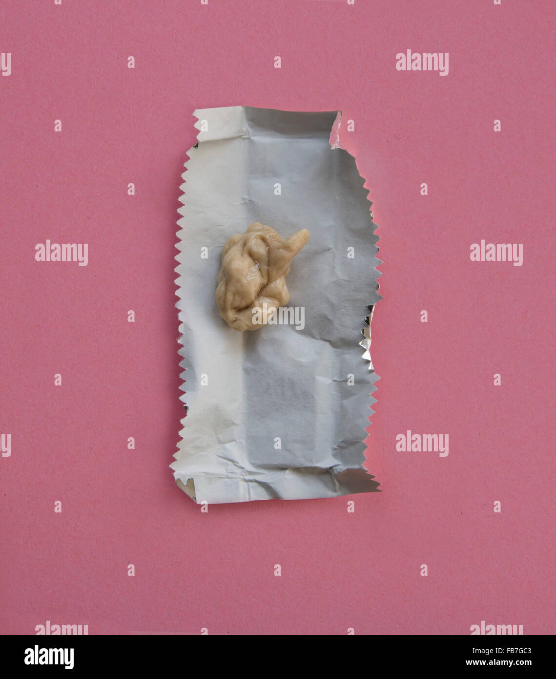 Chewing gum on wrapper over pink background Stock Photo - Alamy