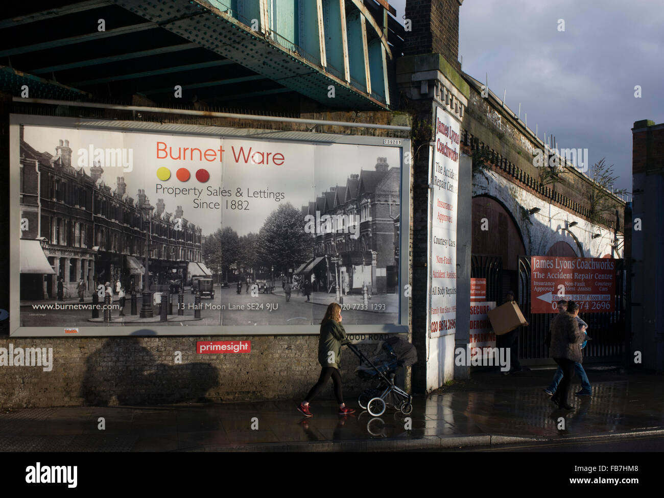 Property estate agent's billboard showing old street scene under ...