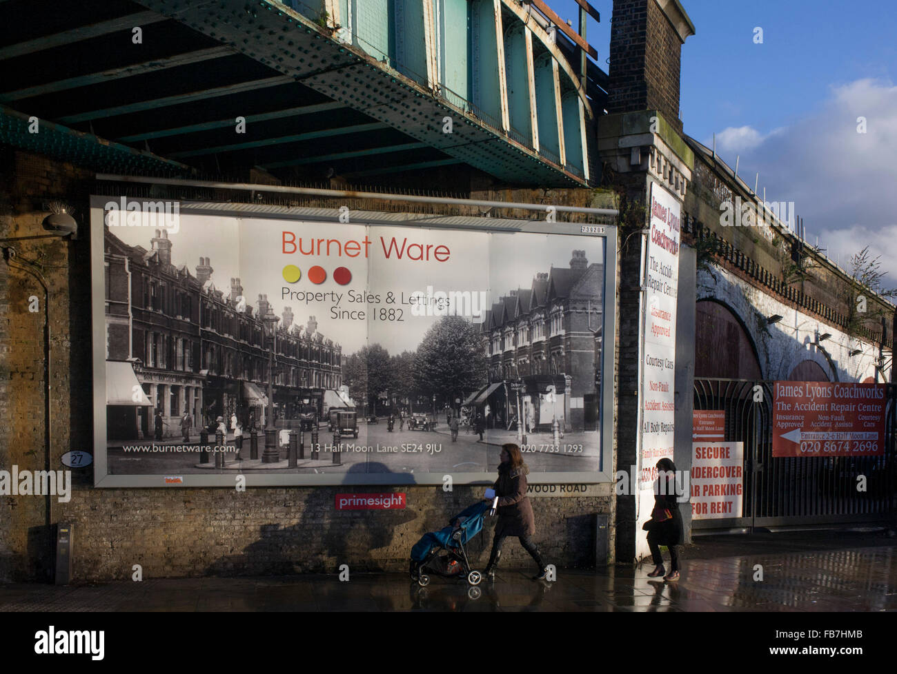 Property estate agent's billboard showing old street scene under ...