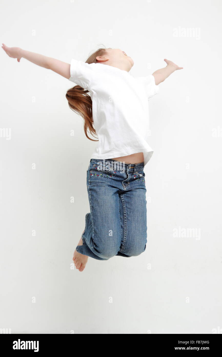 Funny girl poses faces for the camera Stock Photo - Alamy