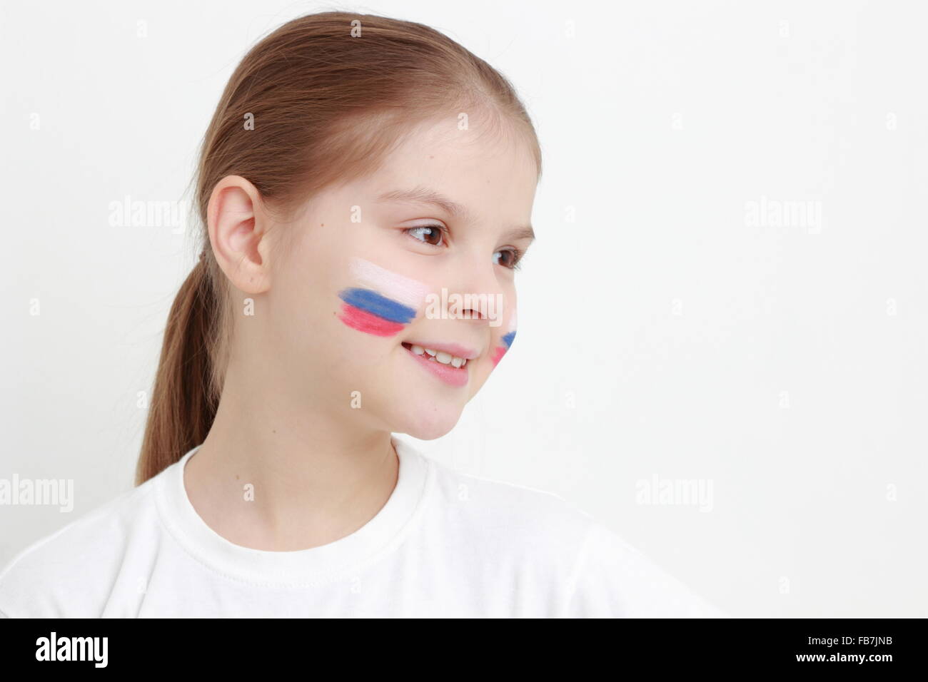 Smiley happy little girl with Russian flag symbol Stock Photo - Alamy