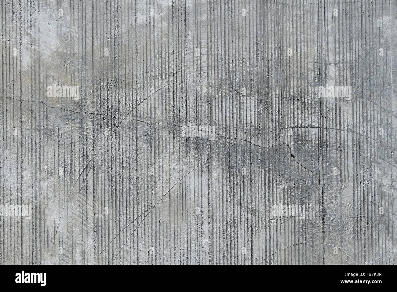 Grey concrete wall with parallel traces from rubbed finish processing ...