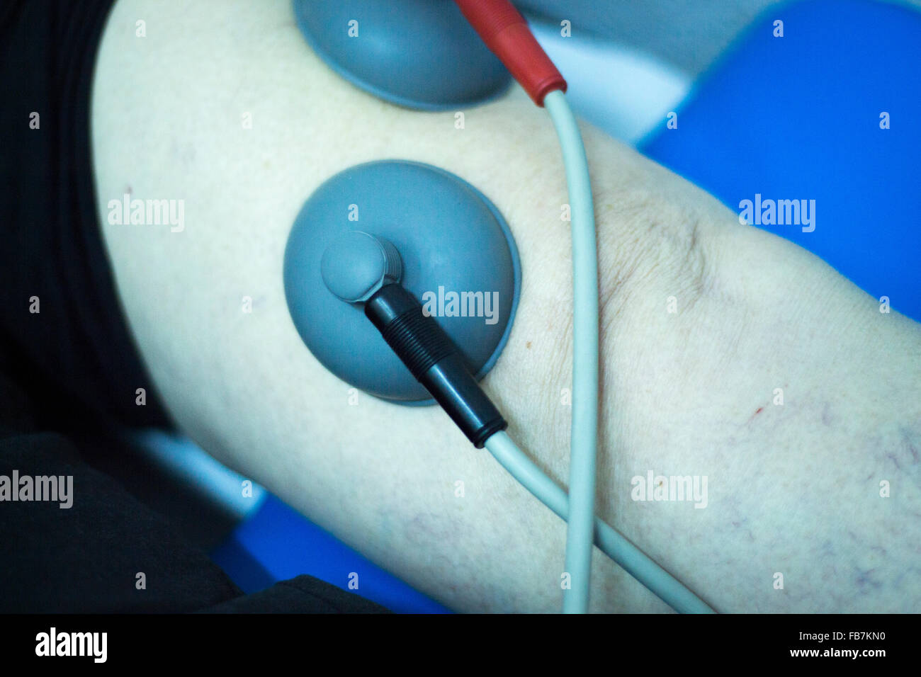 Physiotherapy and orthopedics clinic patient in electrical impulse ...