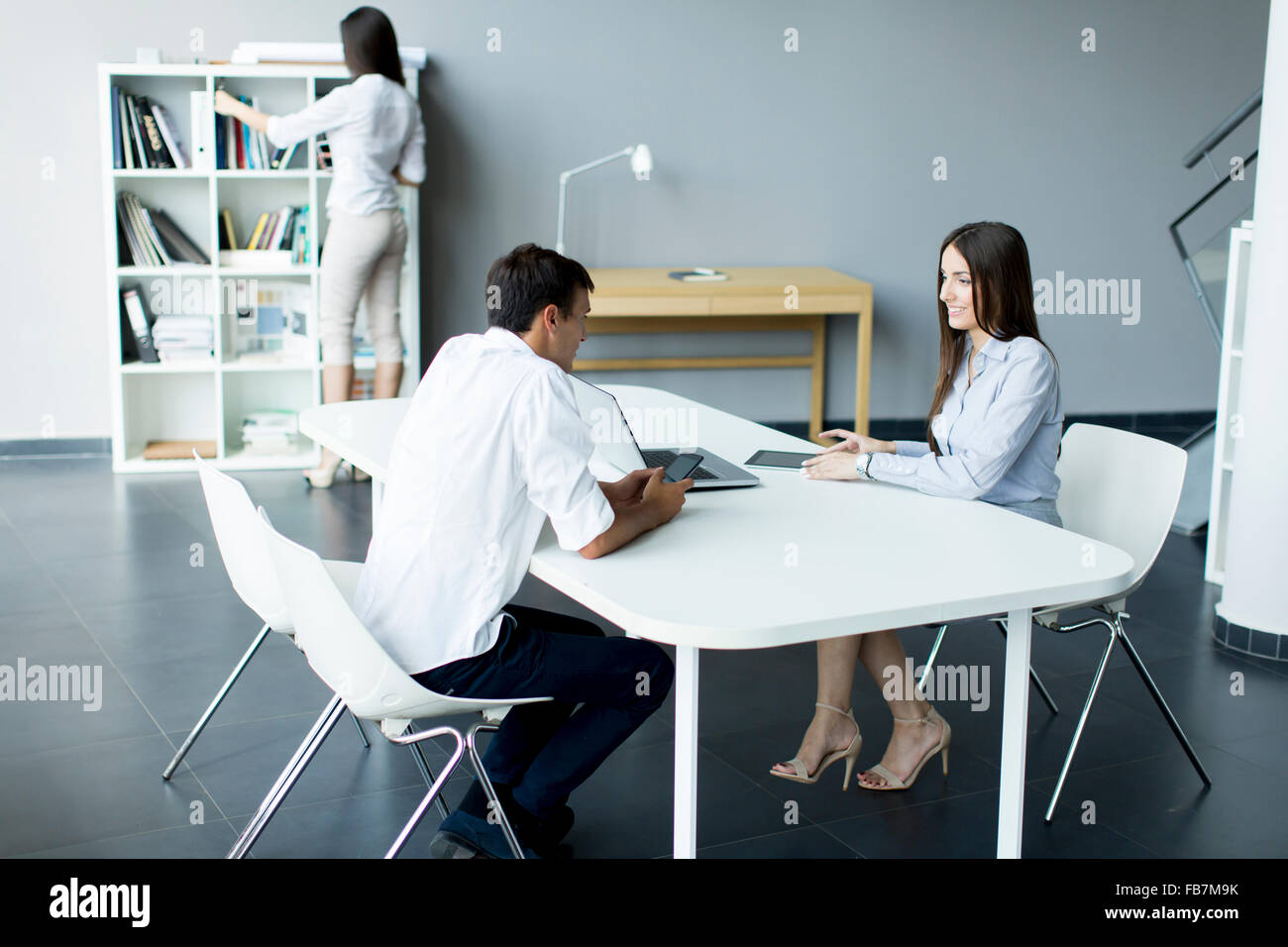 Teamwork in the office Stock Photo - Alamy