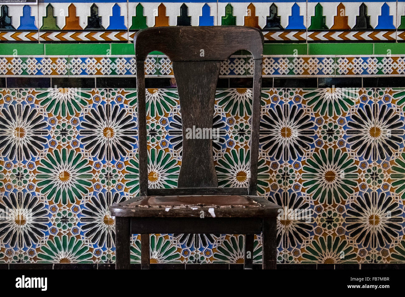 Chair against Tiles Stock Photo - Alamy