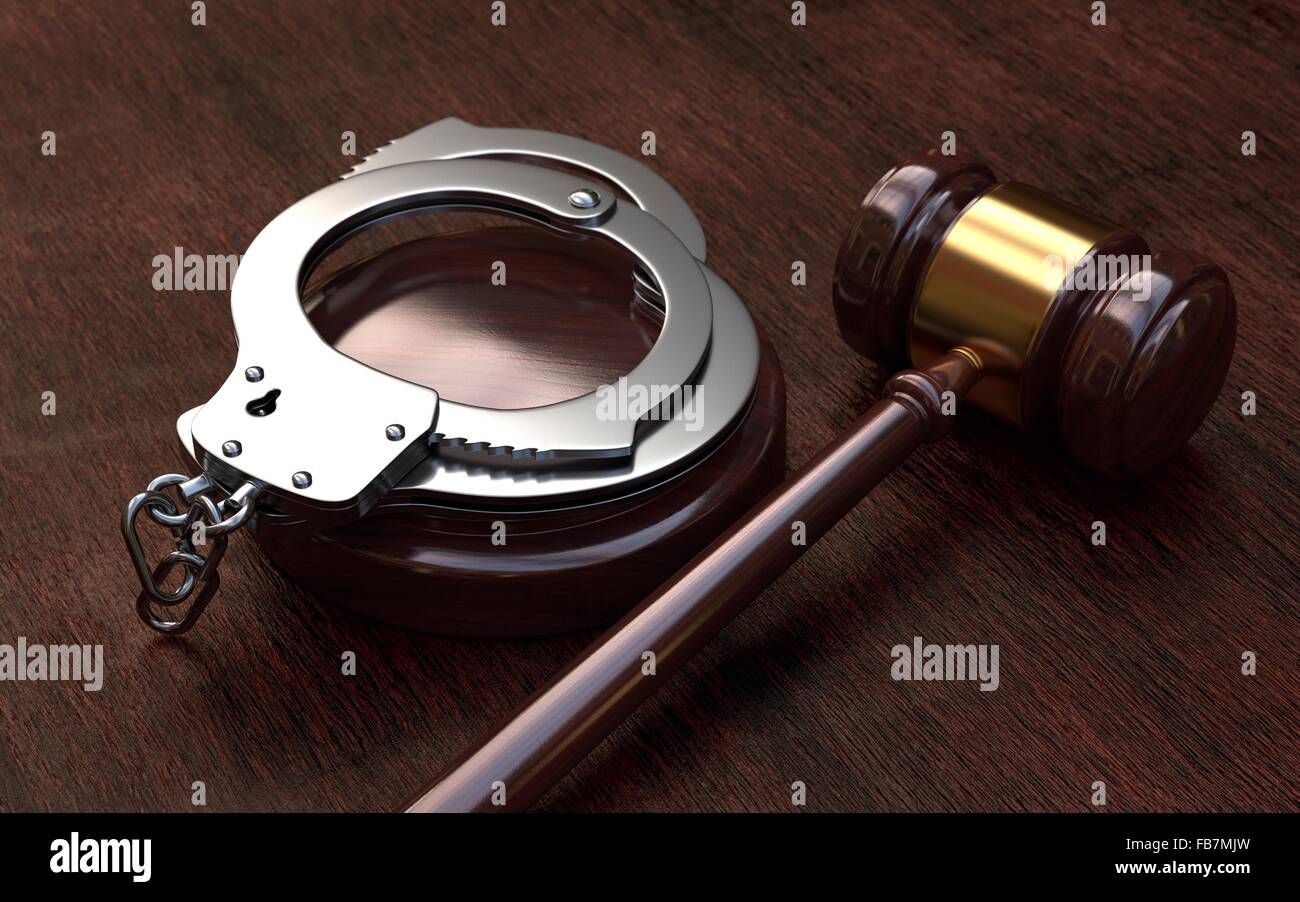 Gavel and handcuffs on wooden, brown table background Stock Photo - Alamy
