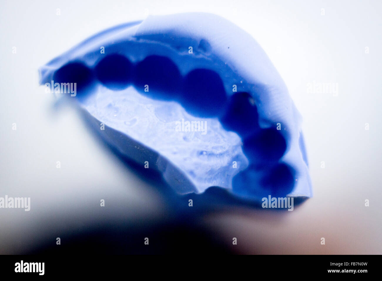 Dental prosthetics clay tooth mold in dentists photo Stock Photo - Alamy