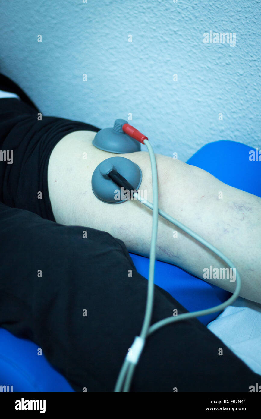 Physiotherapy and orthopedics clinic patient in electrical impulse ...
