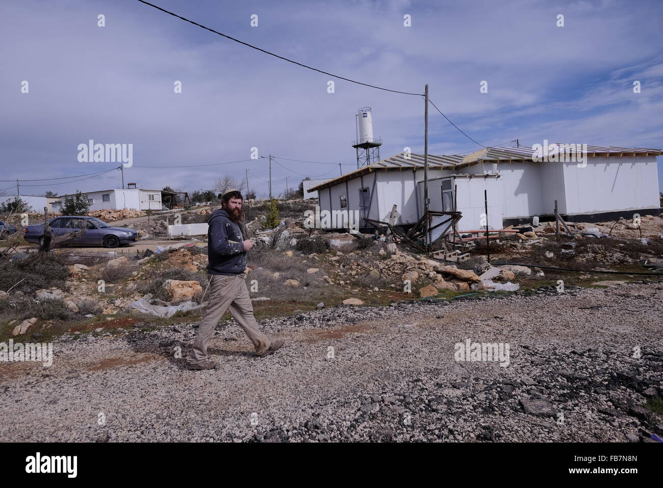 A religious Jewish settler walking in Esh Kodesh which is a small ...