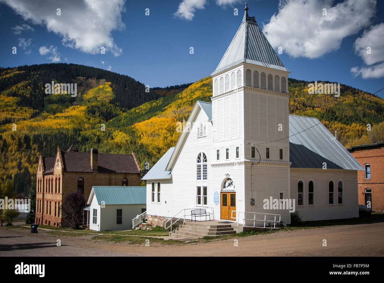 White Church in fall colors in mountainous Rico, Colorado, USA Stock ...