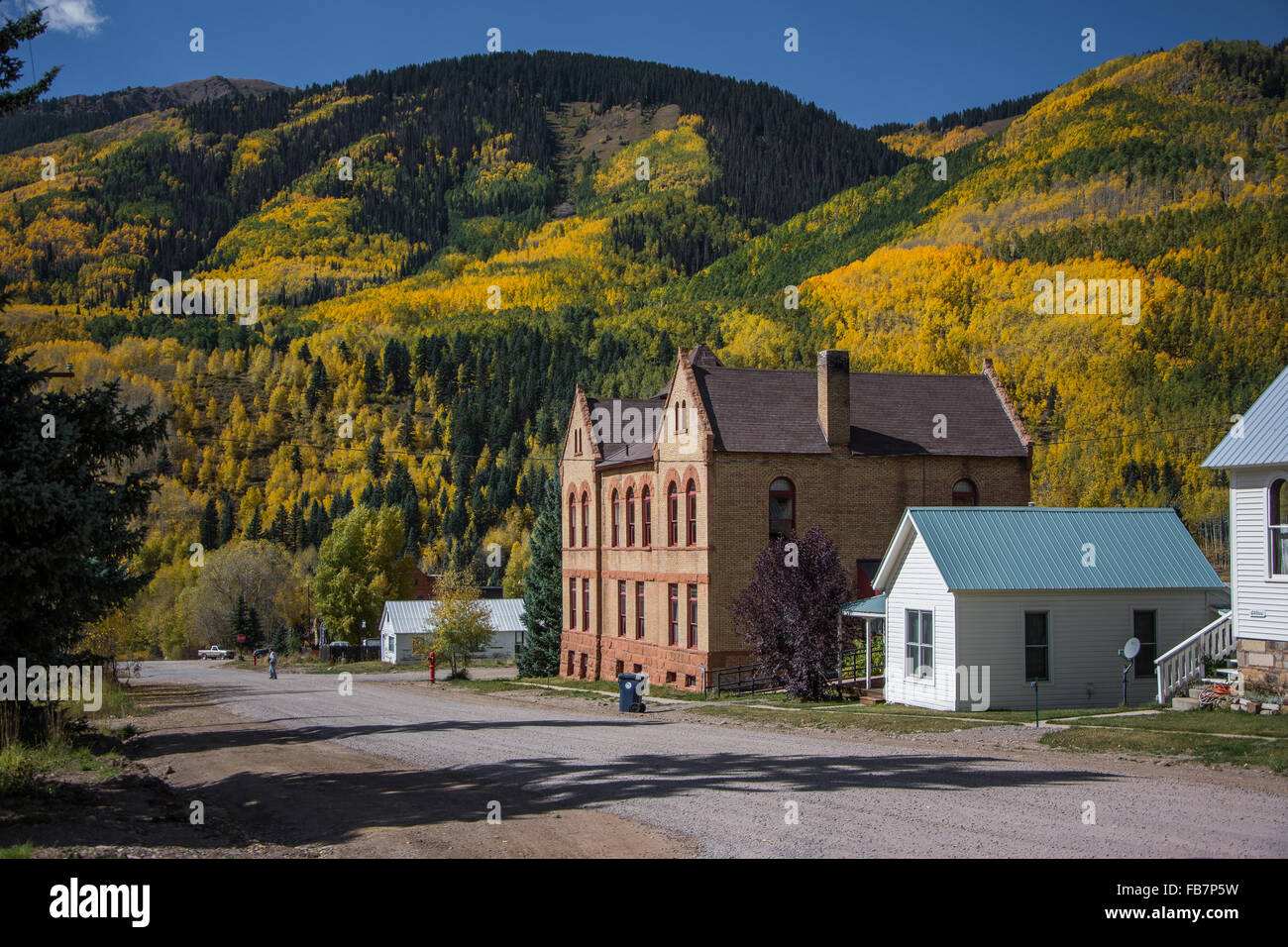 Victorian buildings with fall colors in mountainous Rico, Colorado ...