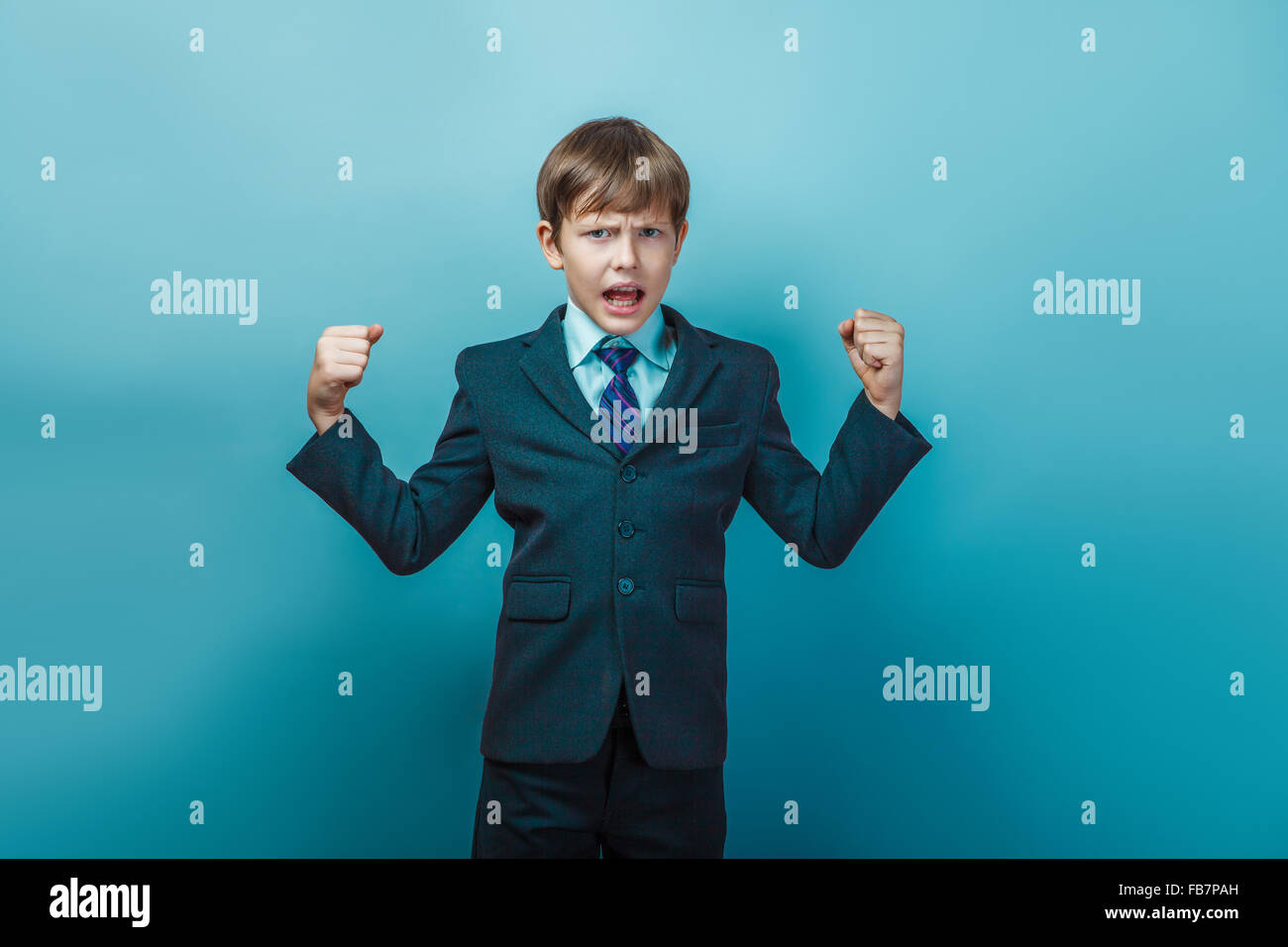 a boy of twelve European appearance in a suit shouting angry o Stock ...