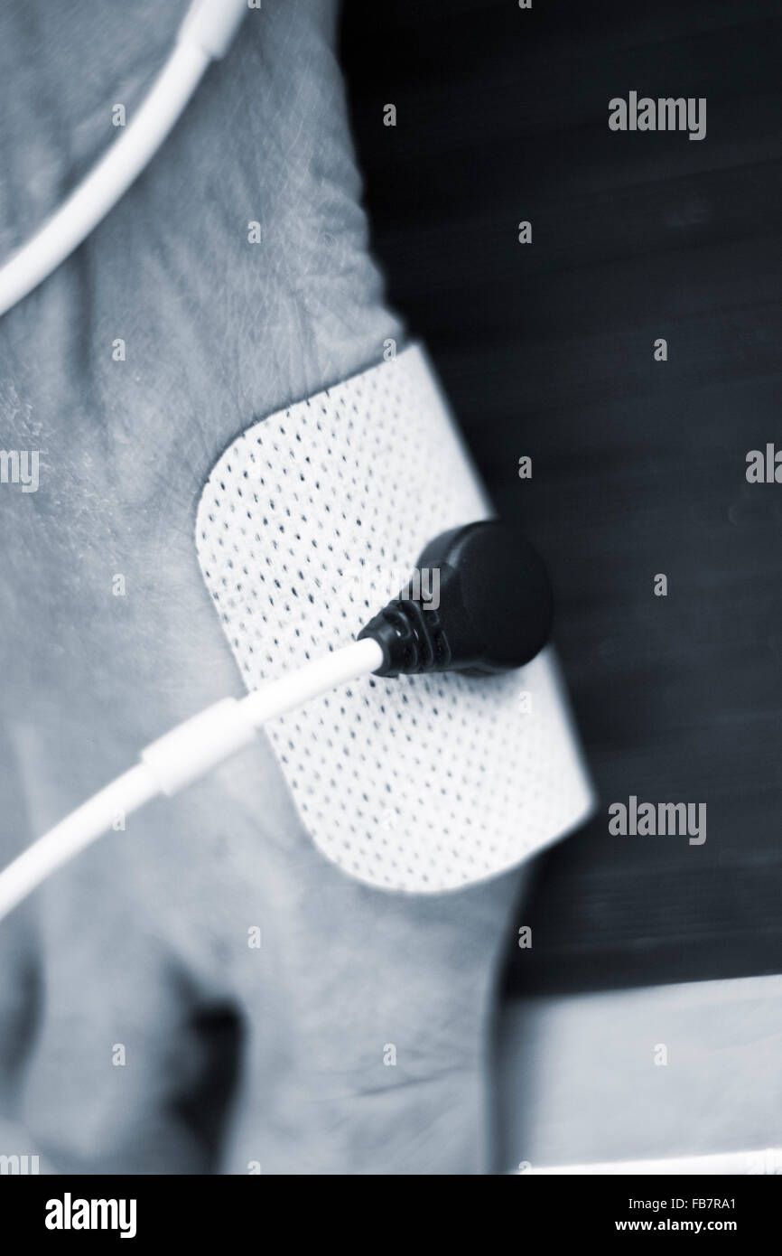 Physiotherapy and orthopedics clinic patient in electrical impulse ...