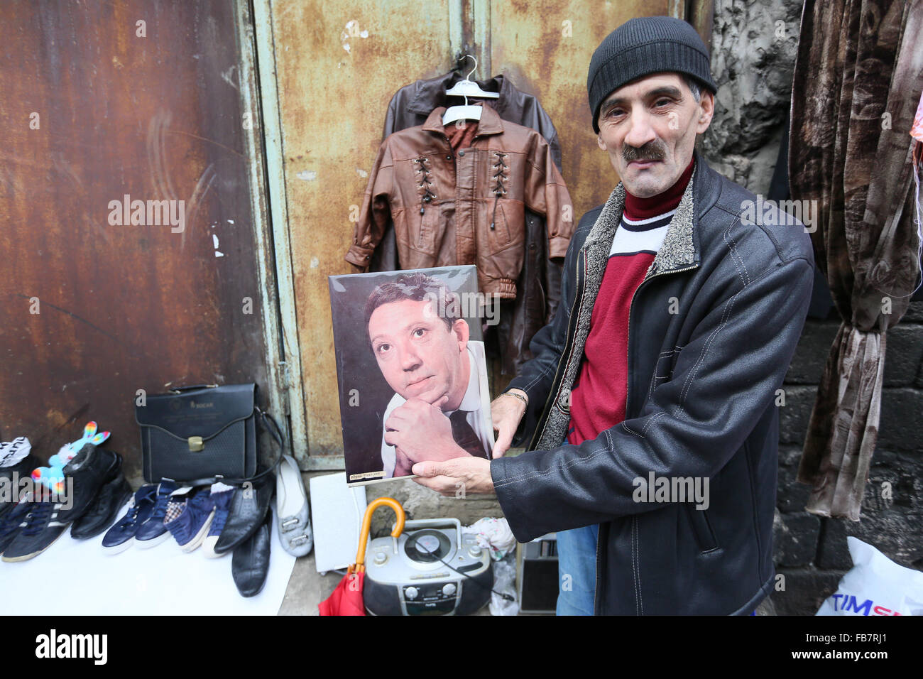 Baku, Azerbaijan. 09th Jan, 2016. A street vendor shows portrait of the ...