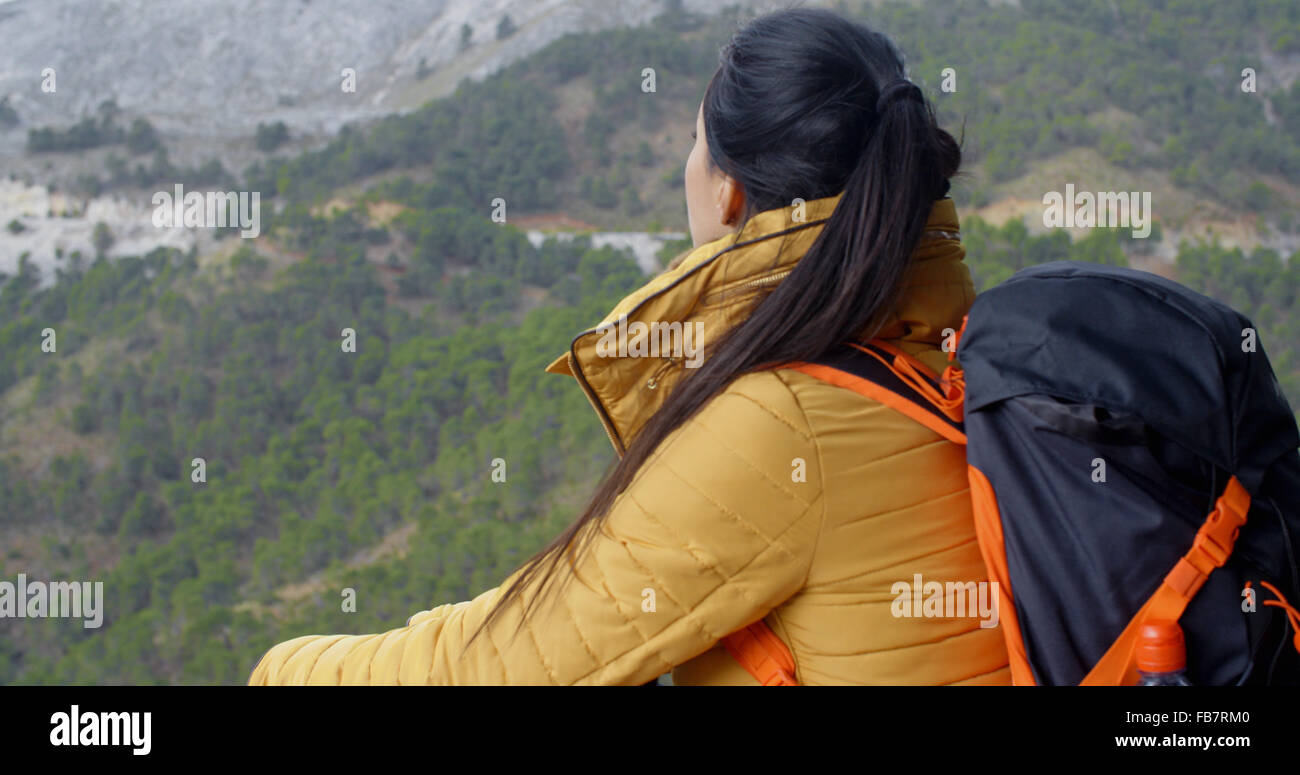 Female backpacker taking a rest Stock Photo - Alamy