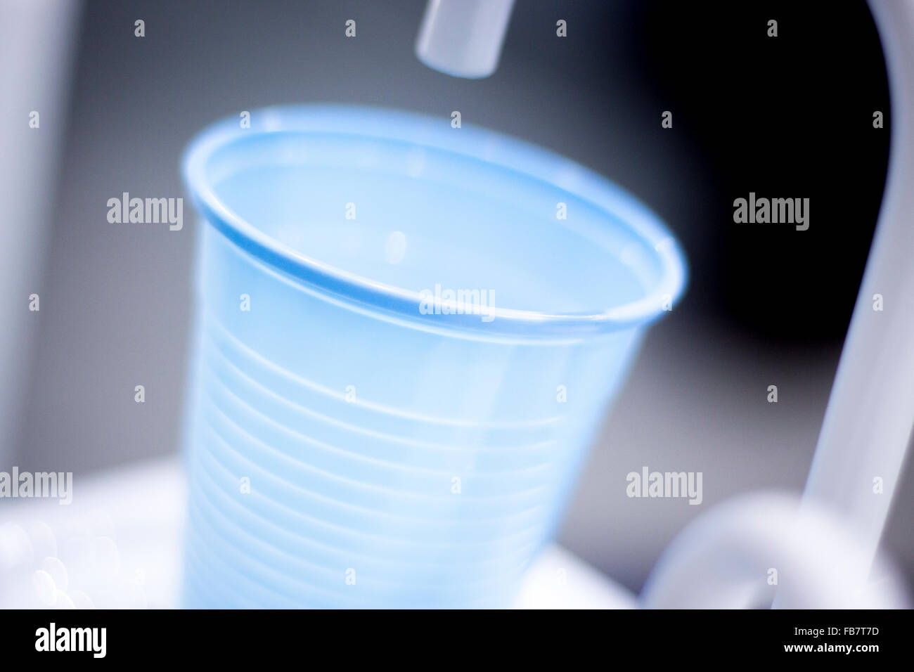 Dentists dental rinse tap and cup in clinic photo Stock Photo - Alamy
