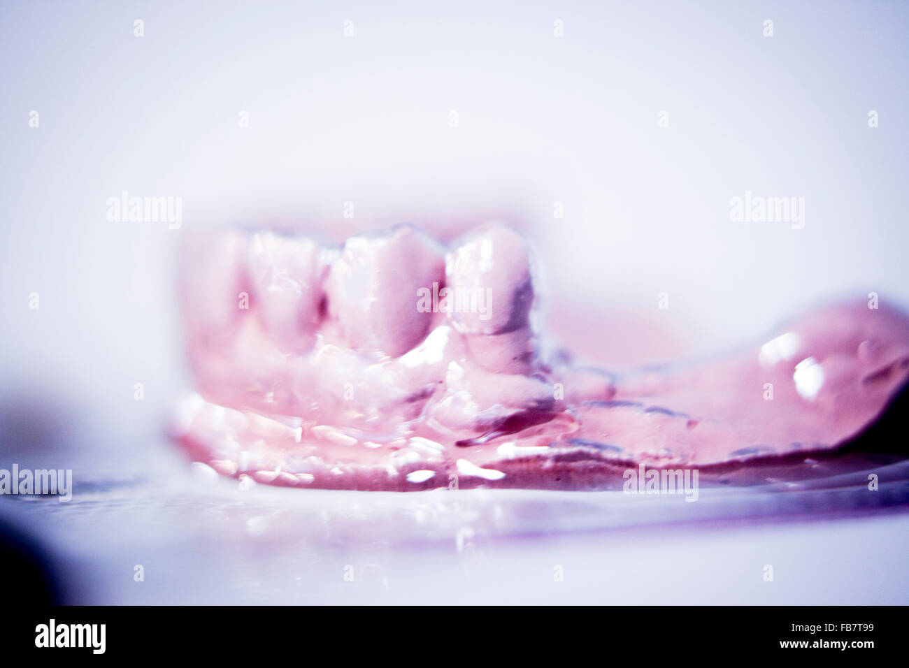 Dental prosthetics clay tooth mold in dentists photo Stock Photo - Alamy