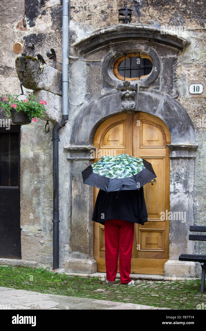 Italy-Abruzzo-Scanno-old house and lady with umbrella Stock Photo - Alamy