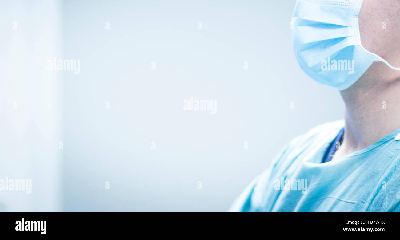 Surgeon in hospital surgery operating room wearing surgical mask photo ...