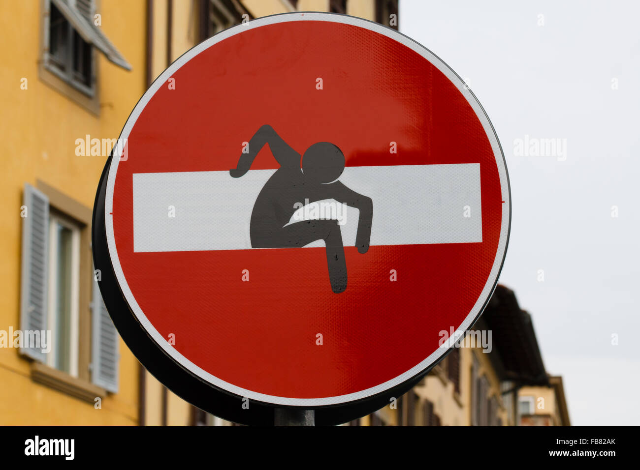 No entry sign with a man that come out from signal, steet art ...