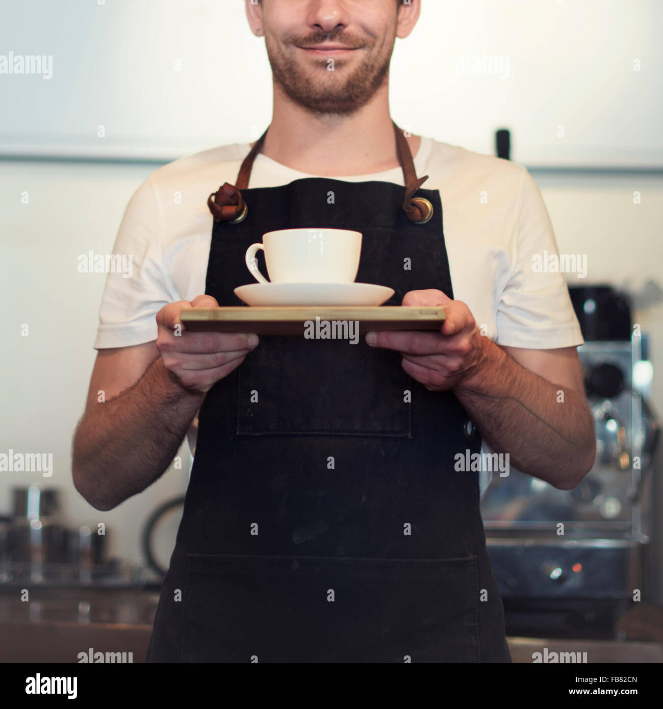 Happy barista making coffee hi-res stock photography and images - Alamy