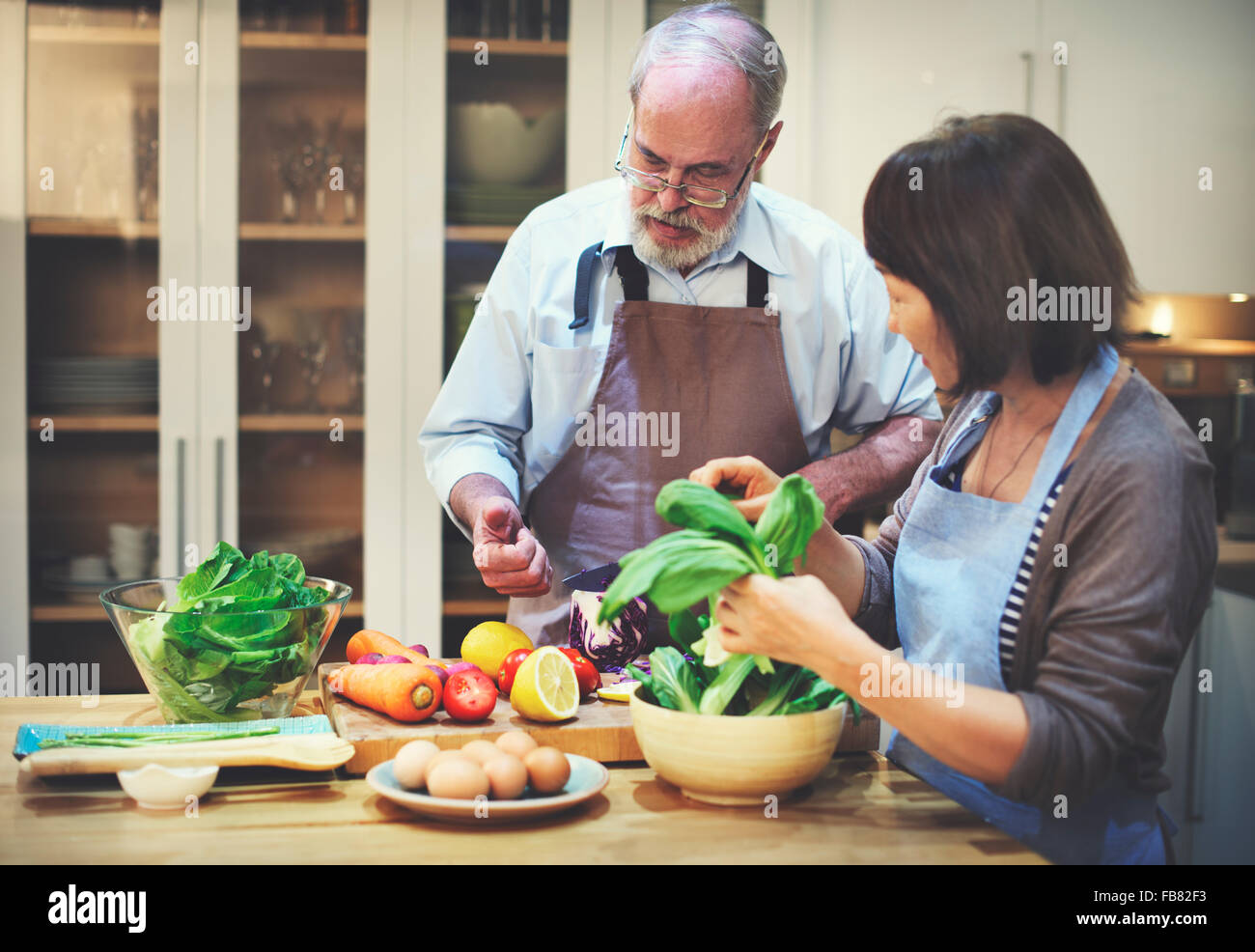Helping her husband to prepare hi-res stock photography and images - Alamy