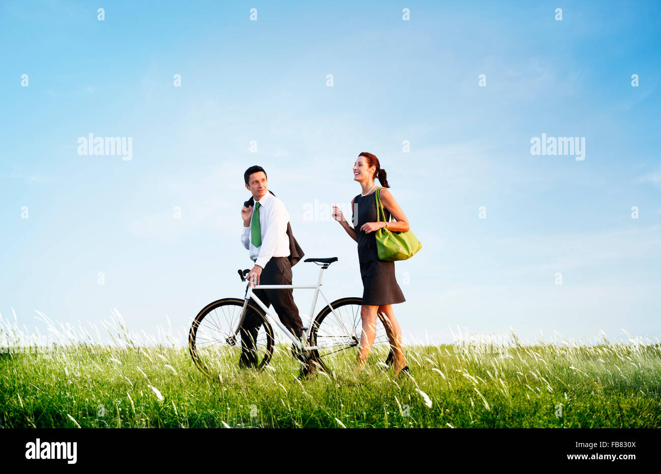 Business Man Woman Pushing Bike Concept Stock Photo - Alamy