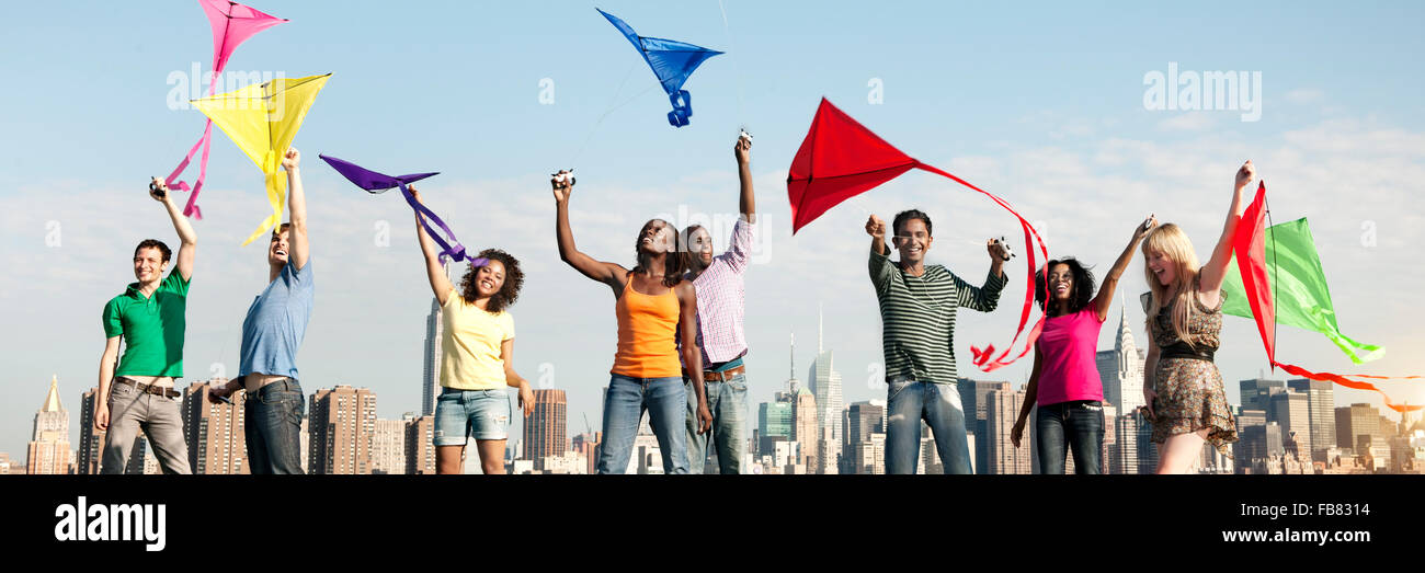 Friends Activity Playing Kite Rooftop Concept Stock Photo - Alamy