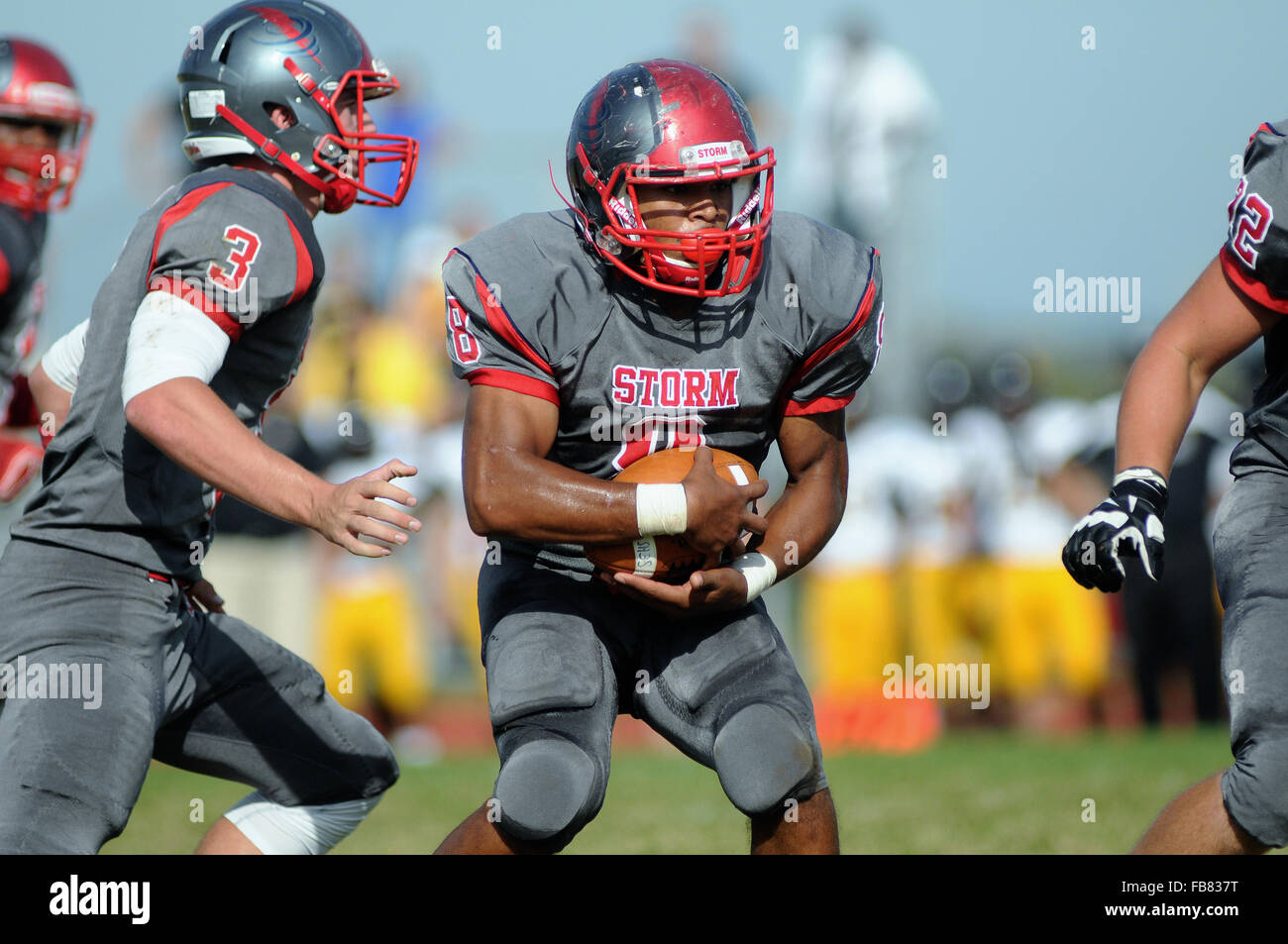 American football player picking the ball hi-res stock photography and ...