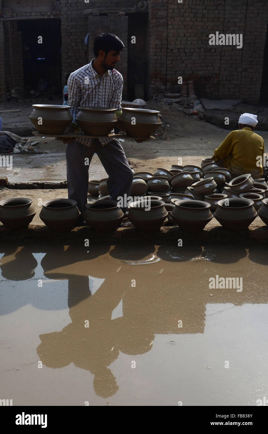 Lahore, Pakistan. 12th Jan, 2016. Pakistani workers busy in preparing ...