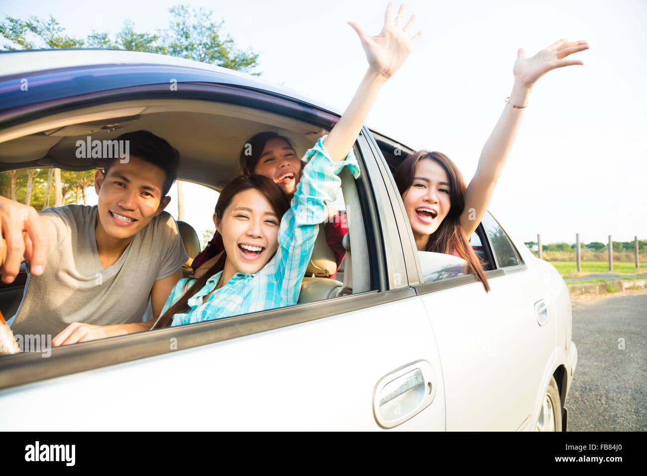 happy young group having fun in the car Stock Photo - Alamy